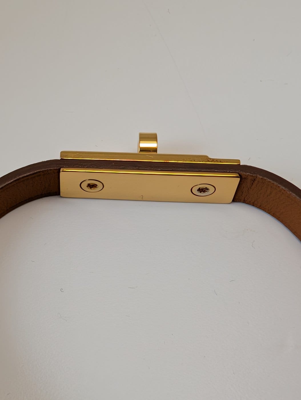 Hermès Kelly Mini - Pulsera de metal bañado en oro y cuero - 58 Facettes
